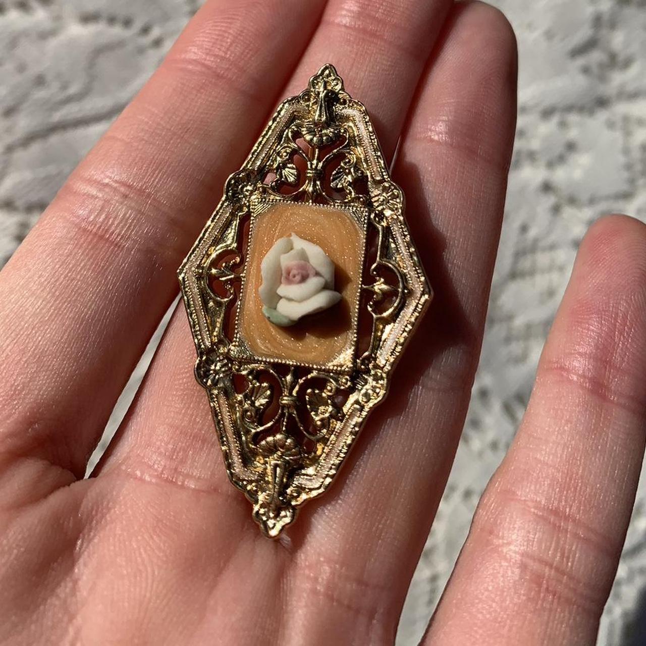 Gold Victorian style broach with a cream... | Depop