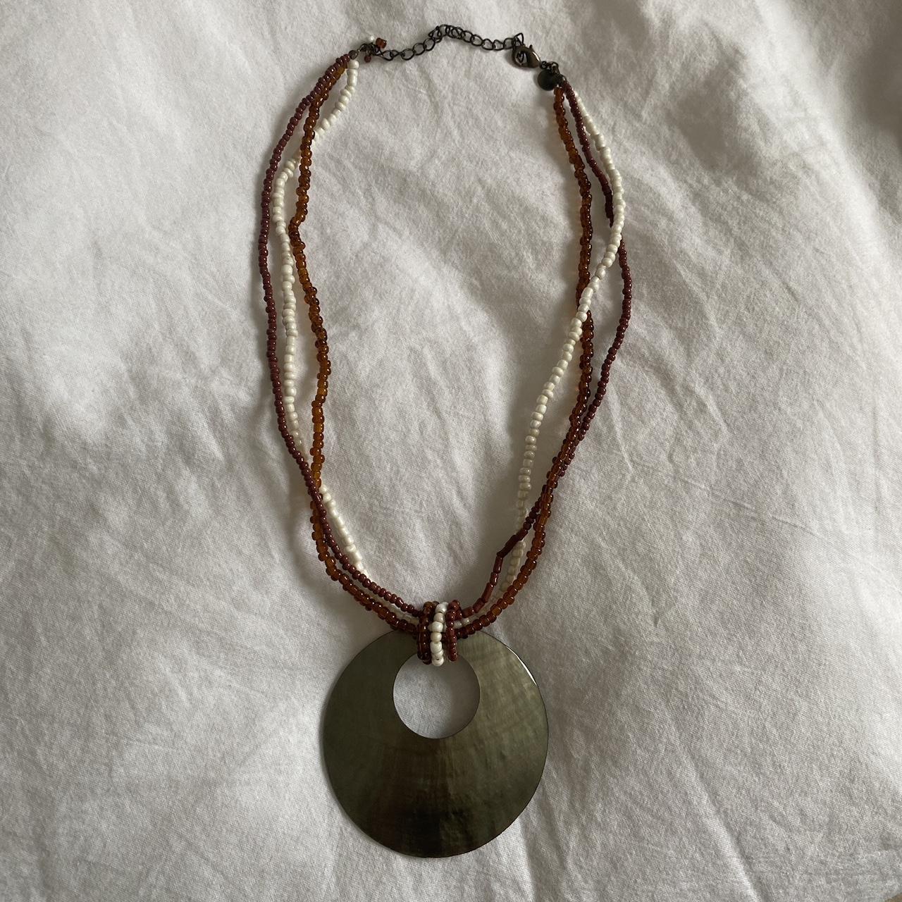 multi beaded necklace with round shell pendent... | Depop