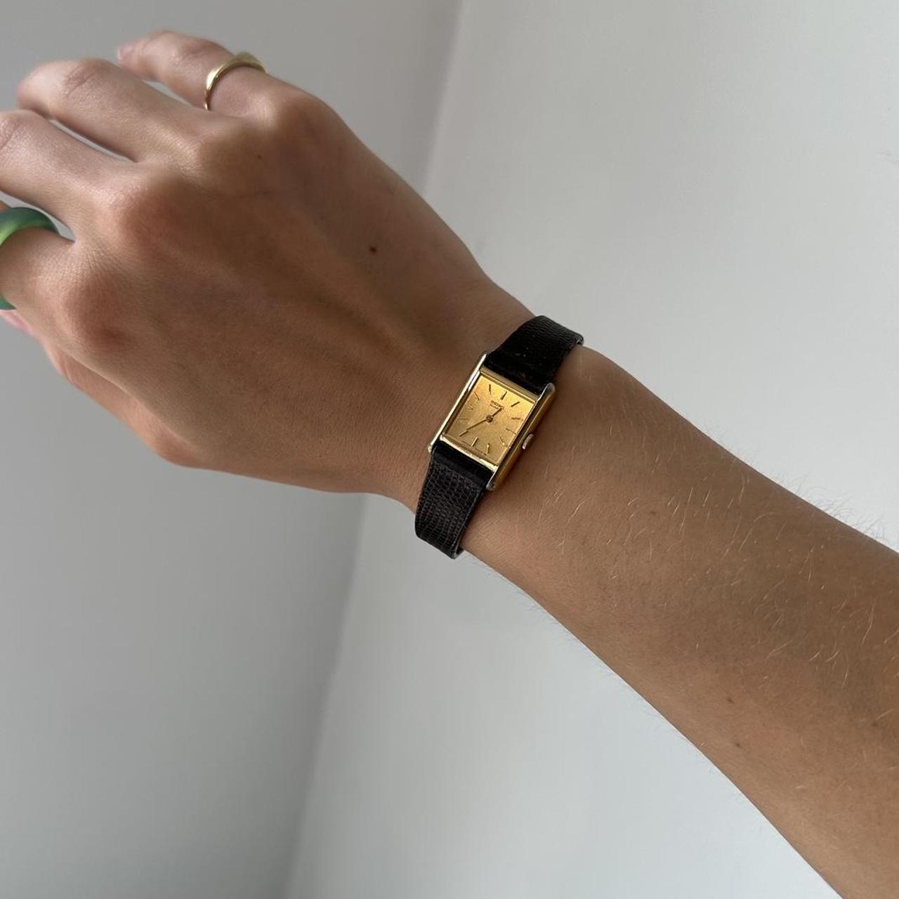 Vintage gold tone mini watch with black leather... - Depop