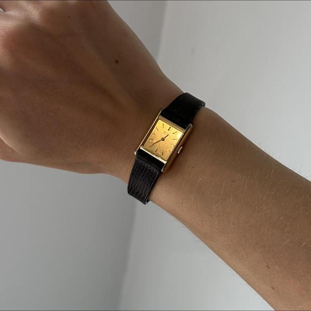 Vintage gold tone mini watch with black leather... - Depop