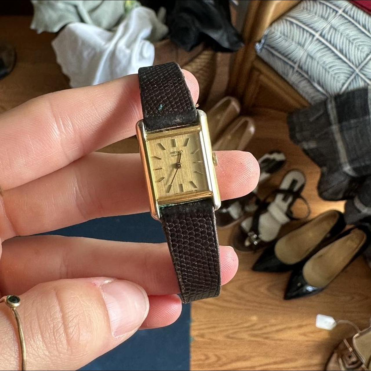 Vintage gold tone mini watch with black leather... - Depop