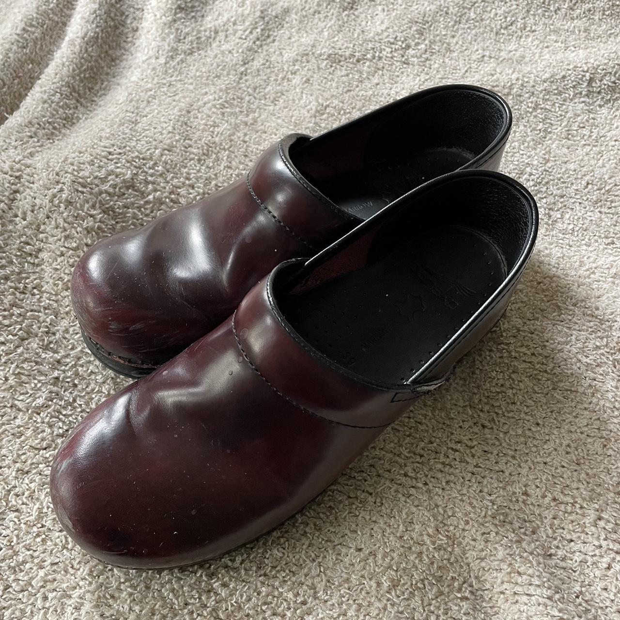 Dansko clogs in burgundy. They have some wear on the... - Depop
