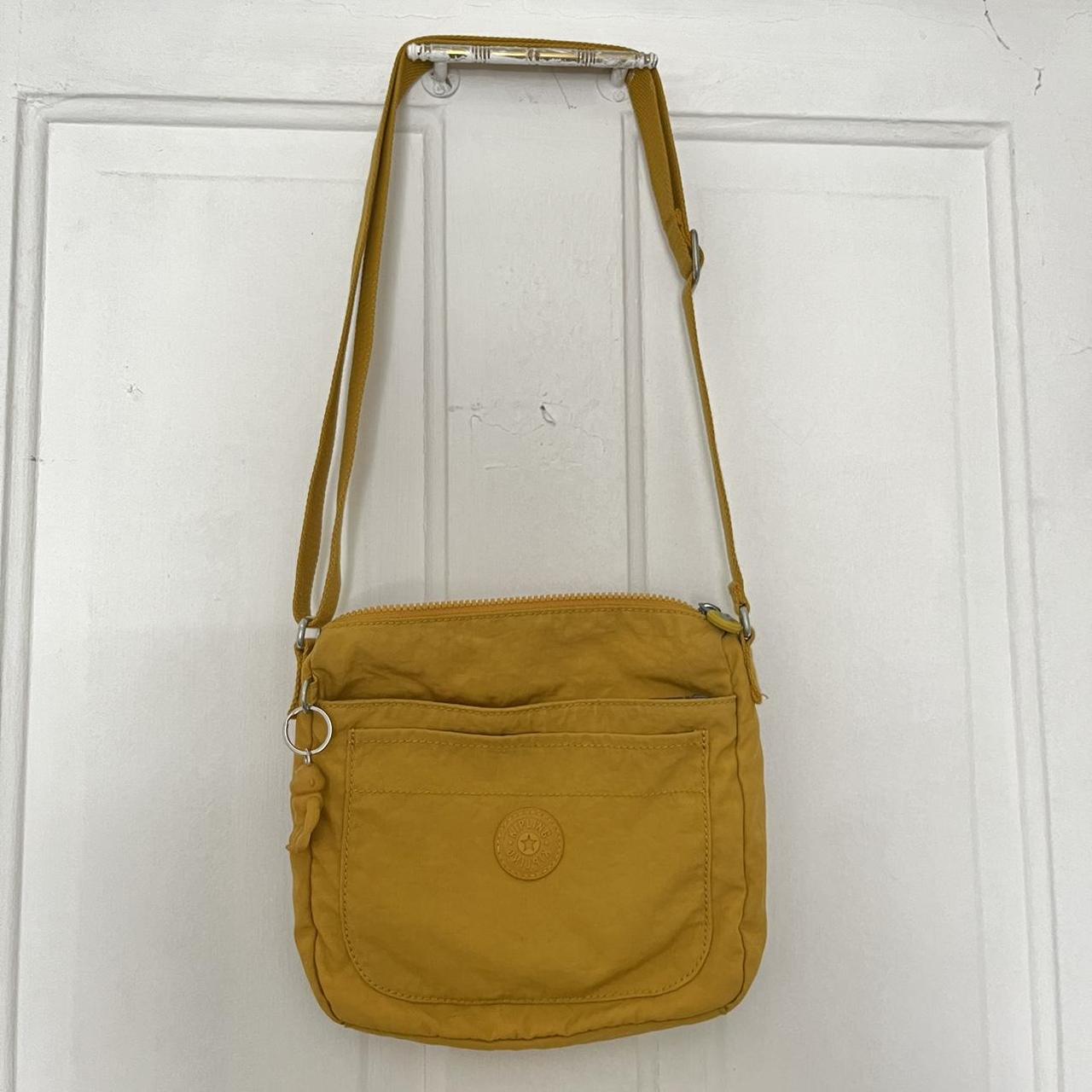 yellow cross body kipling bag some marking shown - Depop