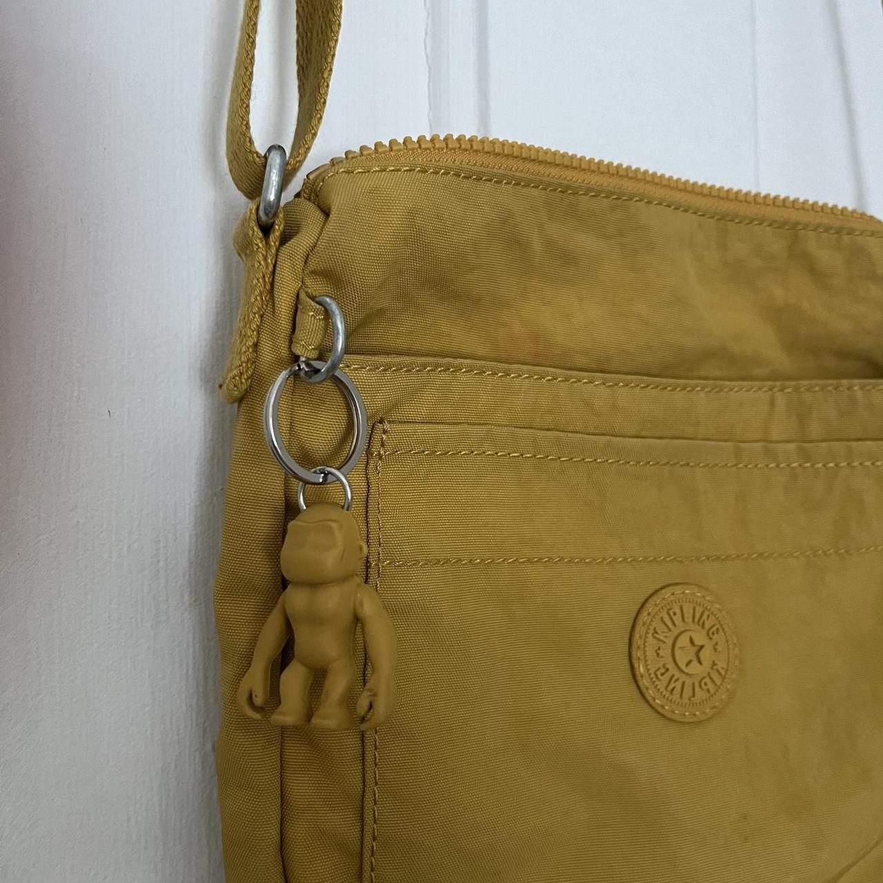 yellow cross body kipling bag some marking shown - Depop