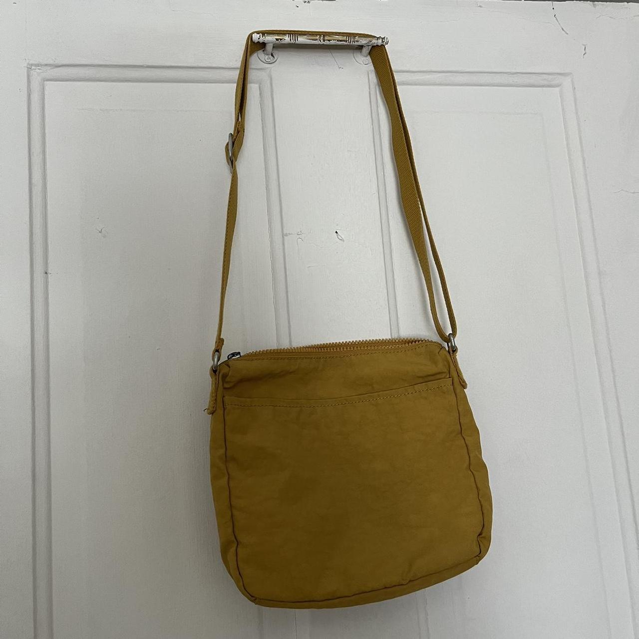 yellow cross body kipling bag some marking shown - Depop