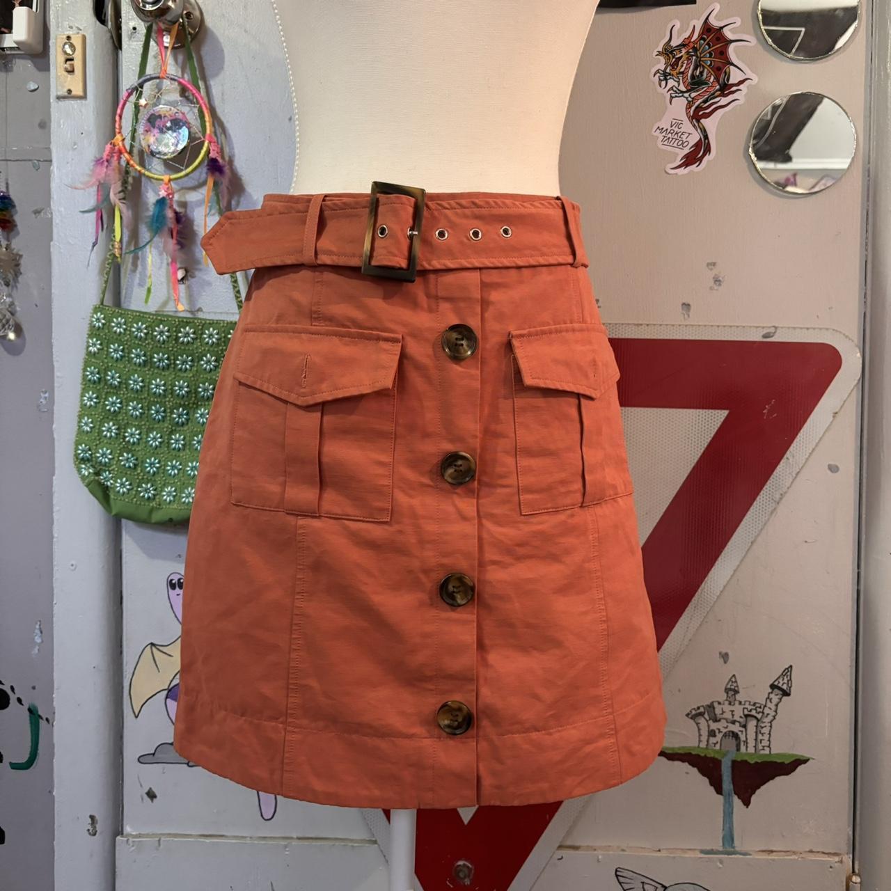 Peach mini skirt Soo cute! Big buckle belt details... | Depop