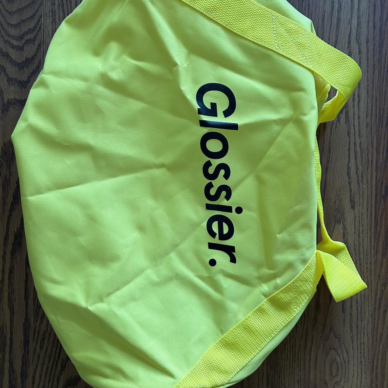 Never used glossier duffle bag. Has side zippered... - Depop