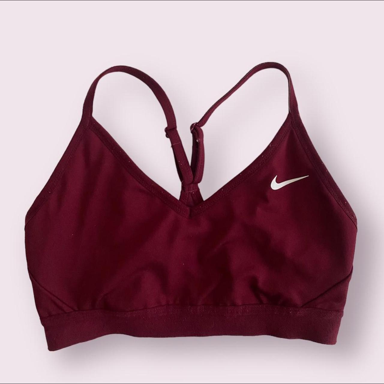 maroon nike sports bra • size: small • slight... - Depop