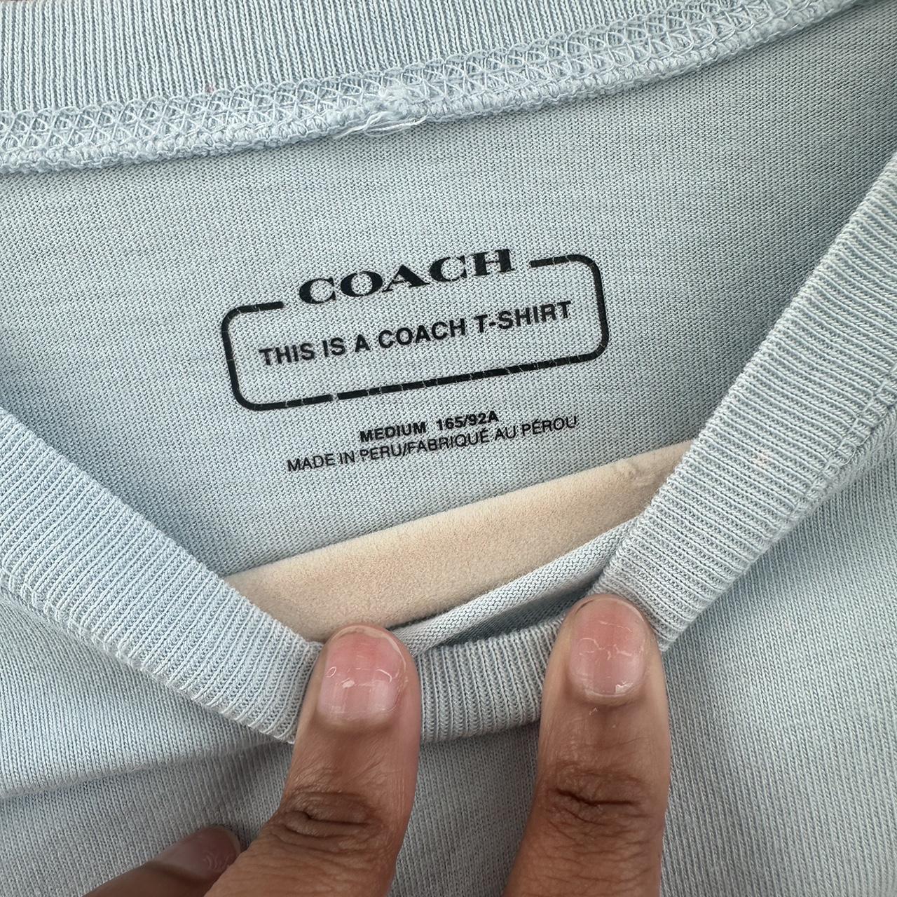 Soft Blue Coach Tank top! Small stain on the back... - Depop