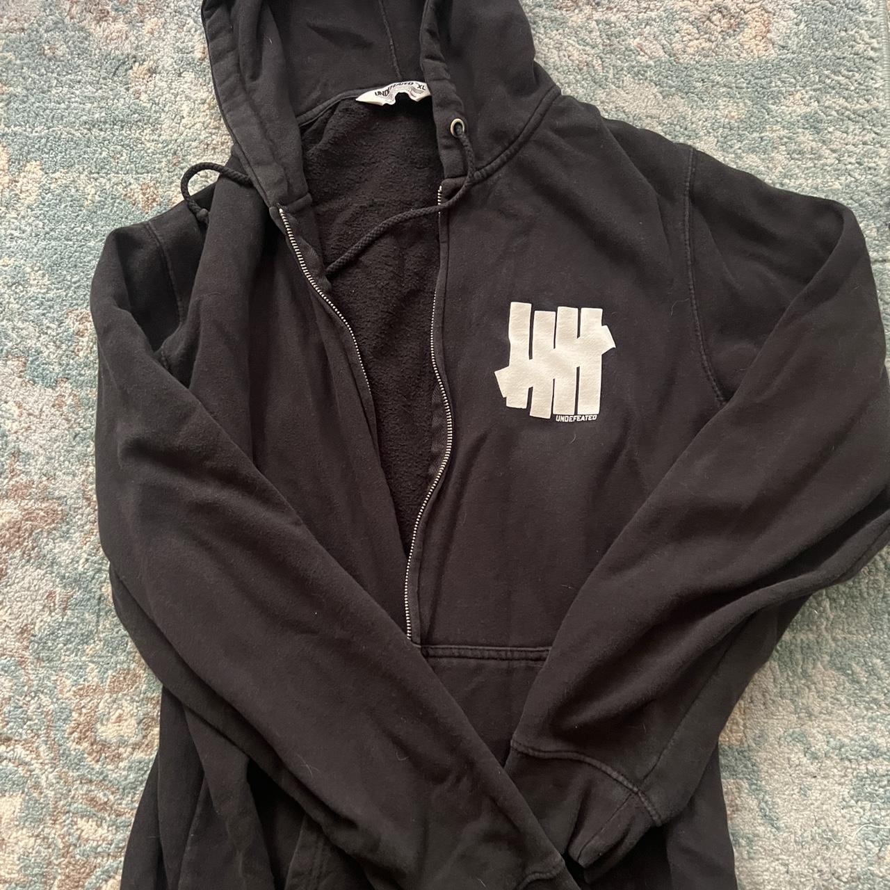 undefeated black zip up hoodie. size xl. but fits a... - Depop