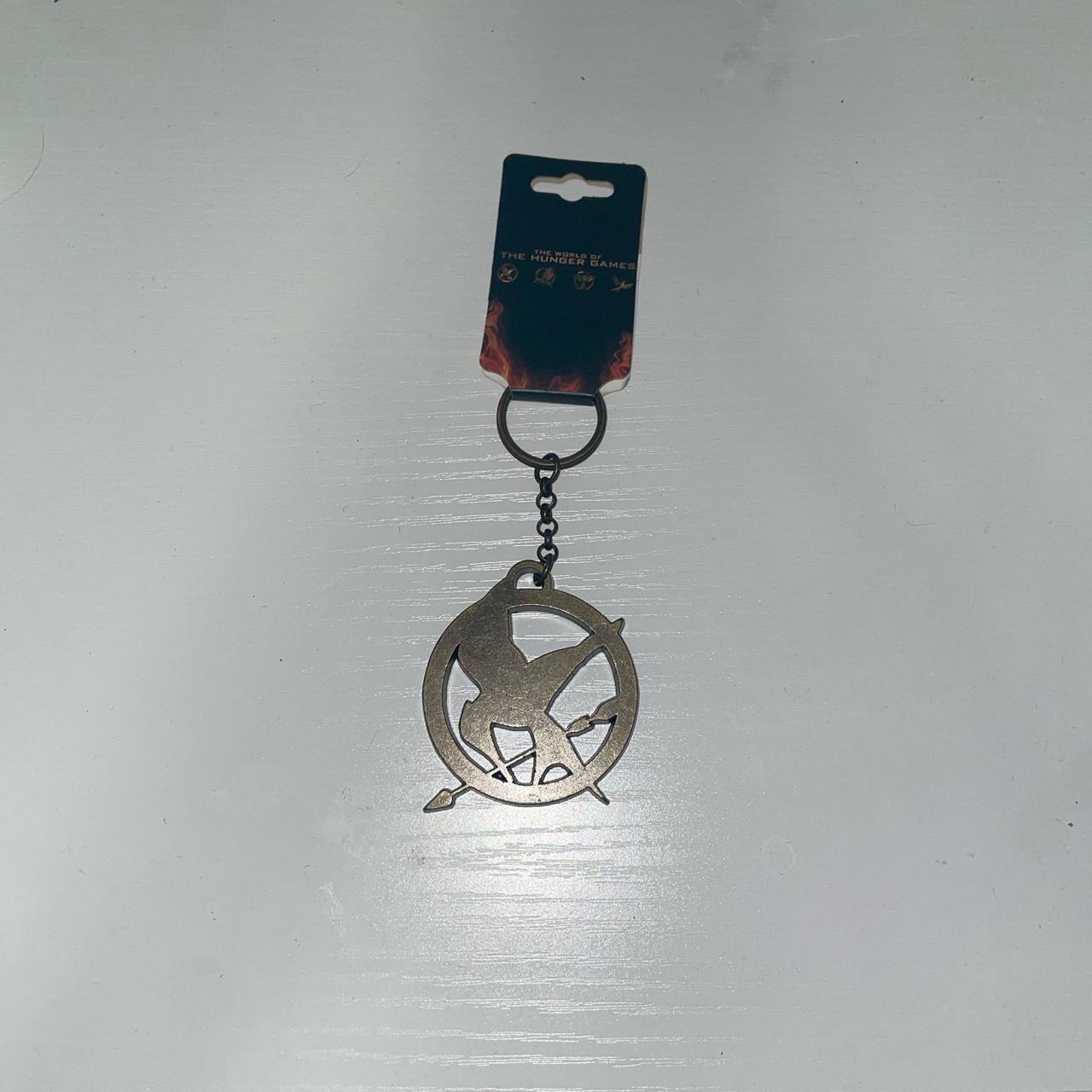Hunger Games Mockingjay Keychain from 2015. Never... - Depop