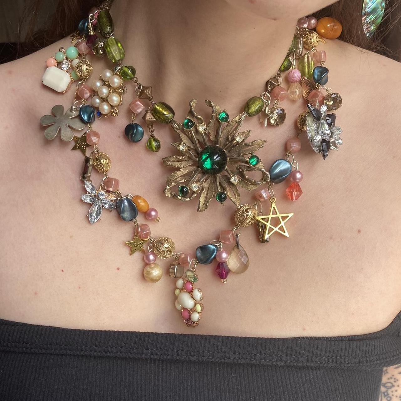 Stacked charm necklace with vintage charms and... - Depop