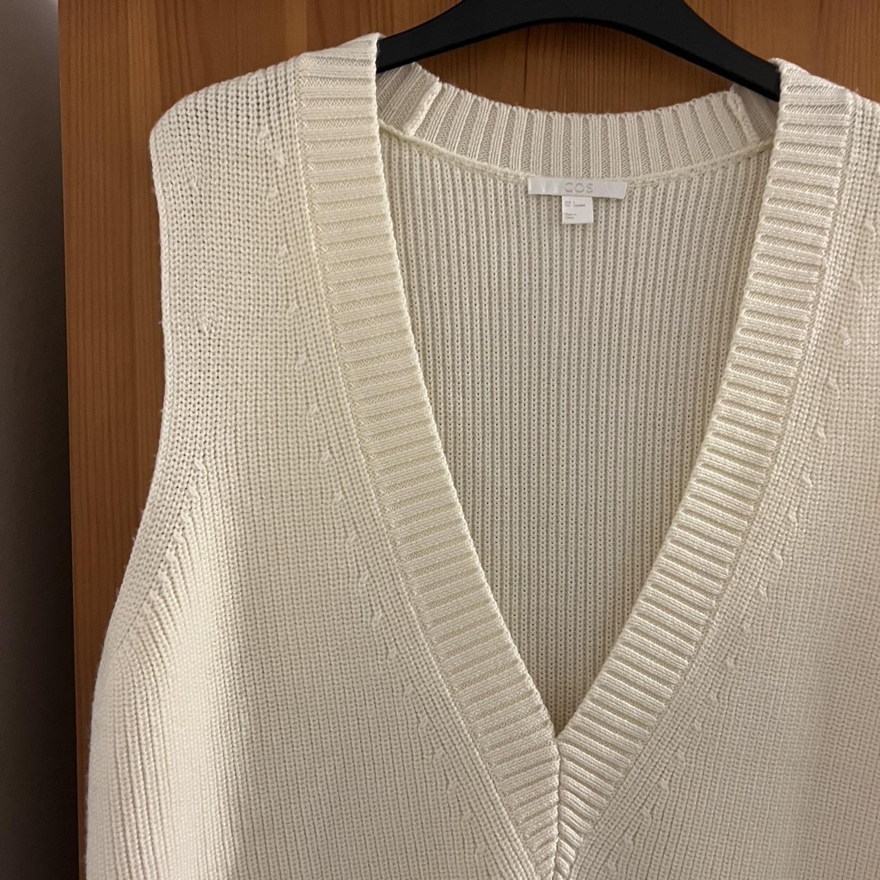 Cream deep v-neck knitted vest by COS. A new take... - Depop