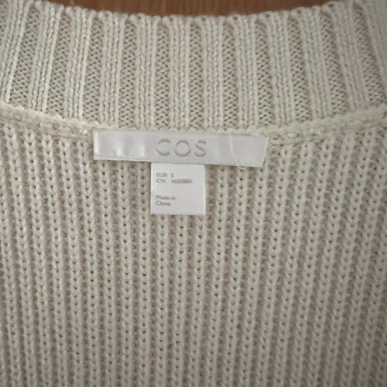 Cream deep v-neck knitted vest by COS. A new take... - Depop