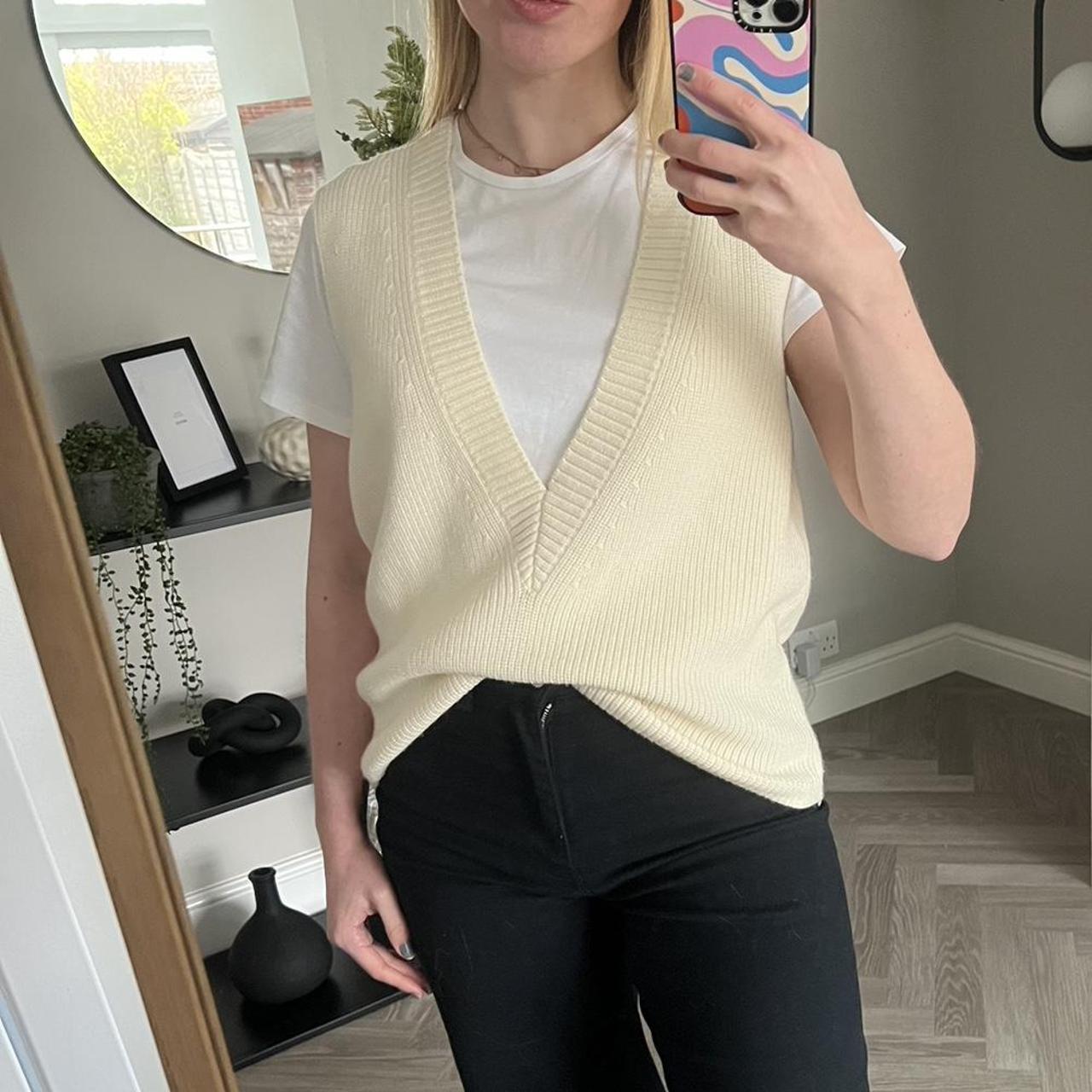 Cream deep v-neck knitted vest by COS. A new take... - Depop