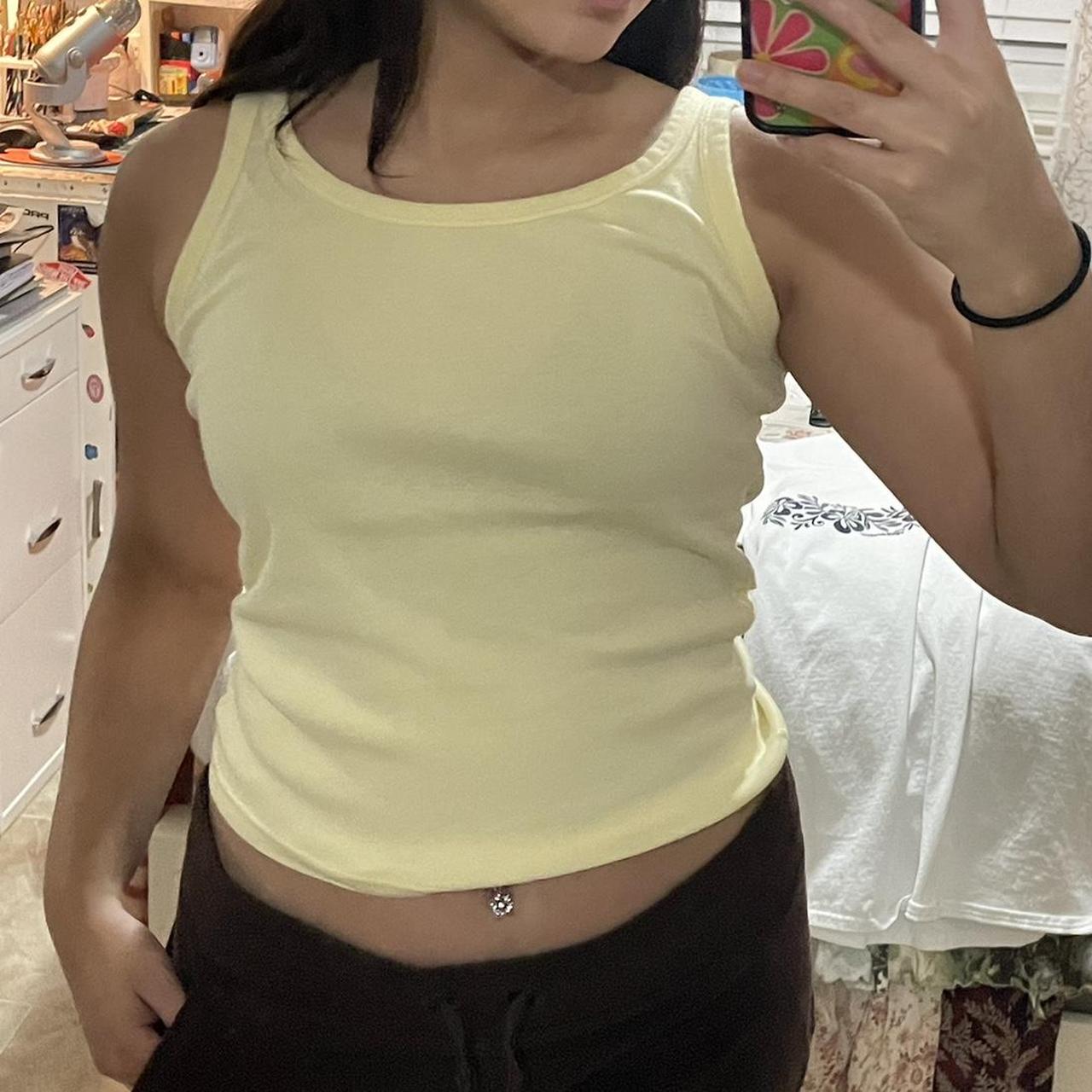 Cherokee Light yellow tank top No size on the tag... - Depop