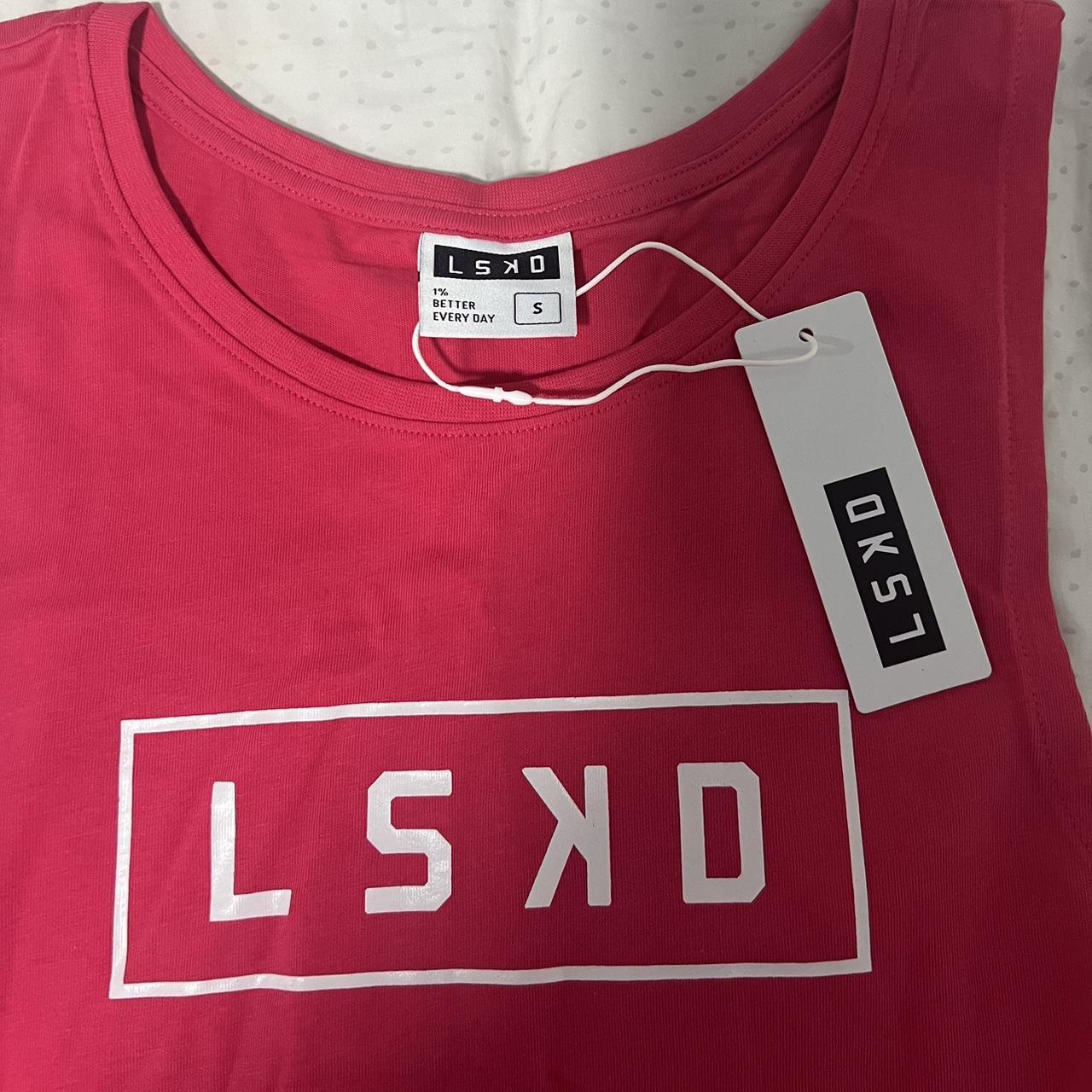 Pink LSKD singlet/tank with white writing size small - Depop