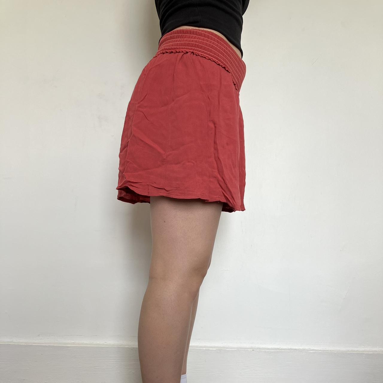 Red floaty mini skirt Elasticated waist shown... - Depop