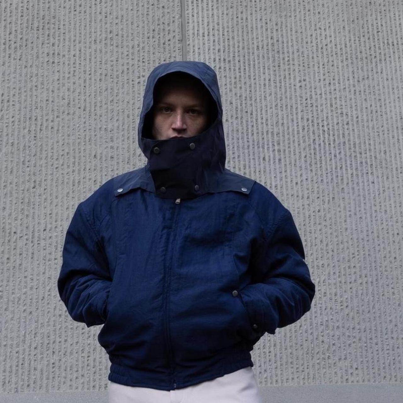 Lockheed Martin blue bomber with sackable hood size... - Depop