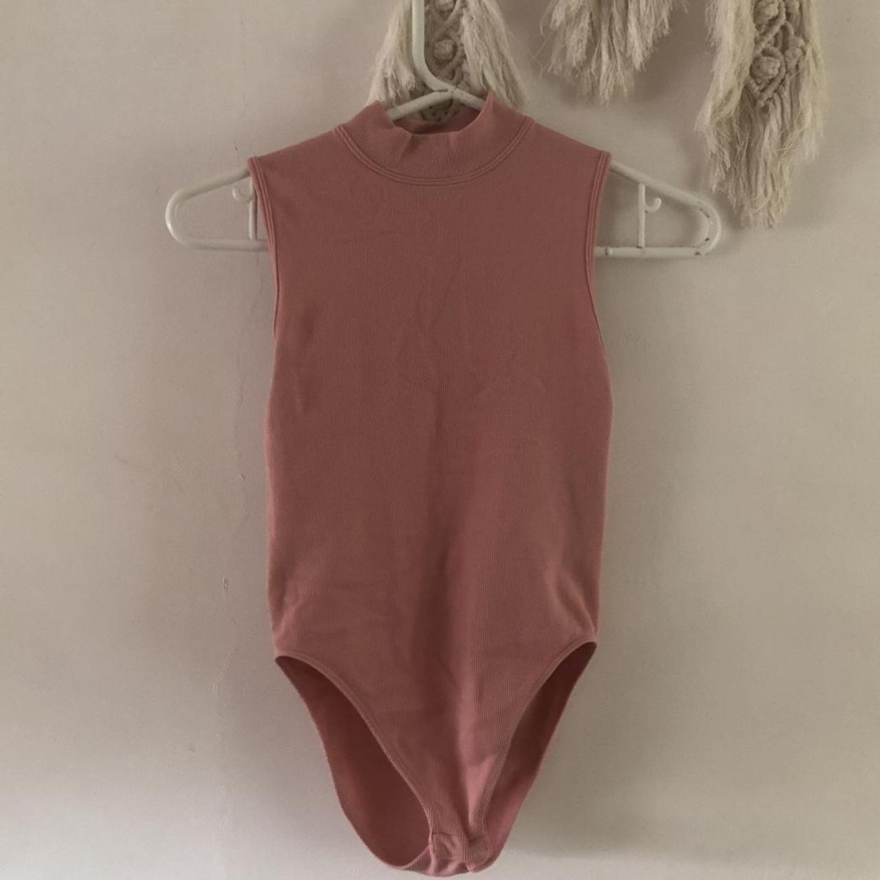 Pink stretchy high neck body suit. Only worn once. - Depop