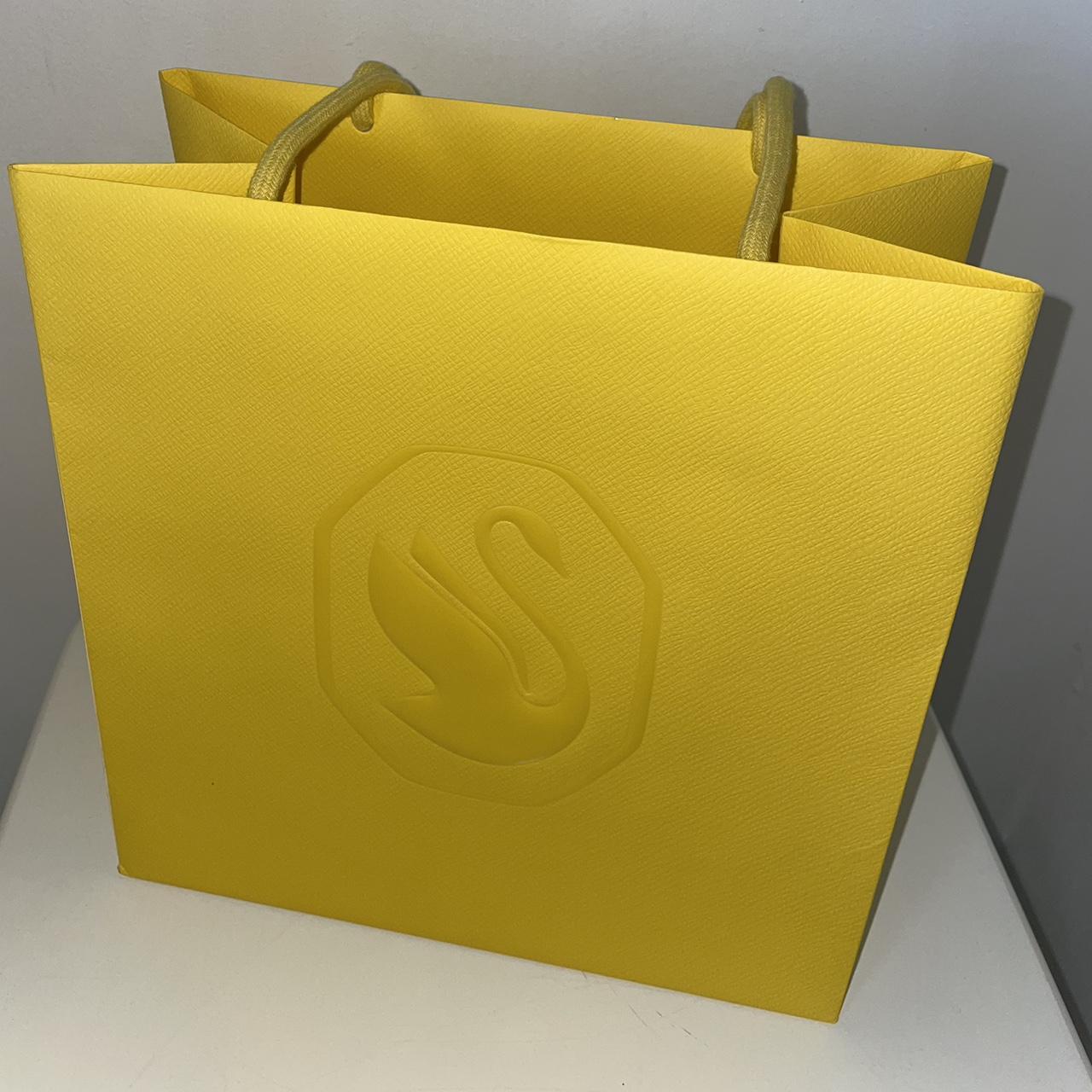 Swarovski yellow carrier bag - Depop