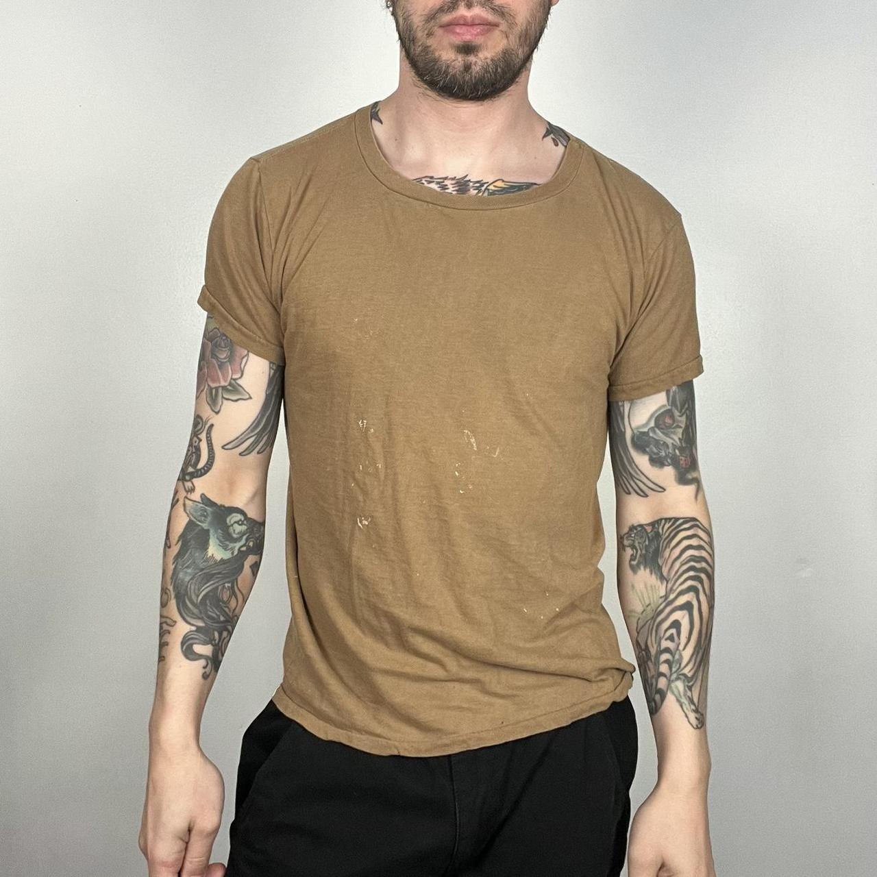 Vintage blank brown T-shirt with great wear and... - Depop