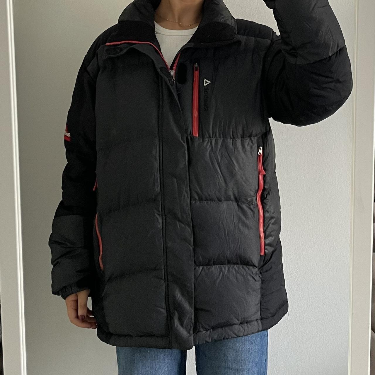 Grey and black reebok puffer jacket, no size on... - Depop