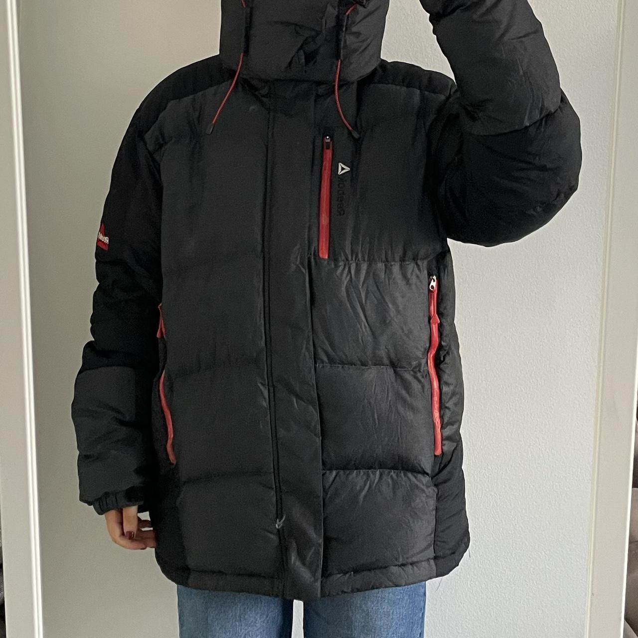 Grey and black reebok puffer jacket, no size on... - Depop