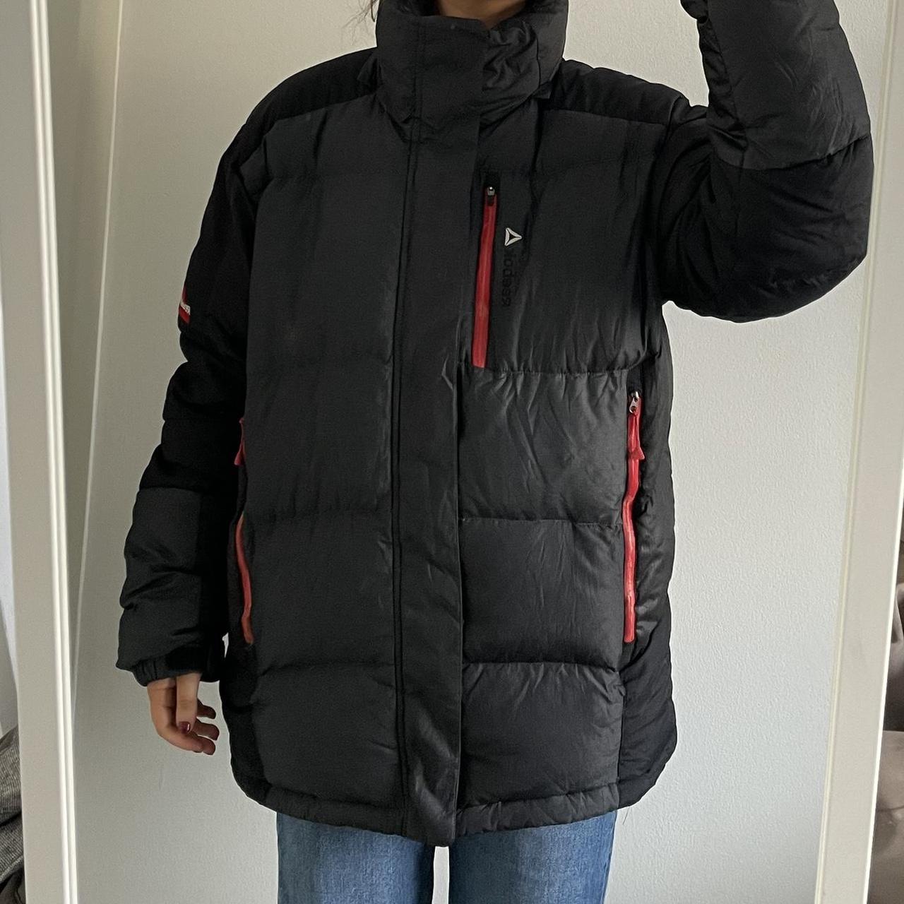 Grey and black reebok puffer jacket, no size on... - Depop