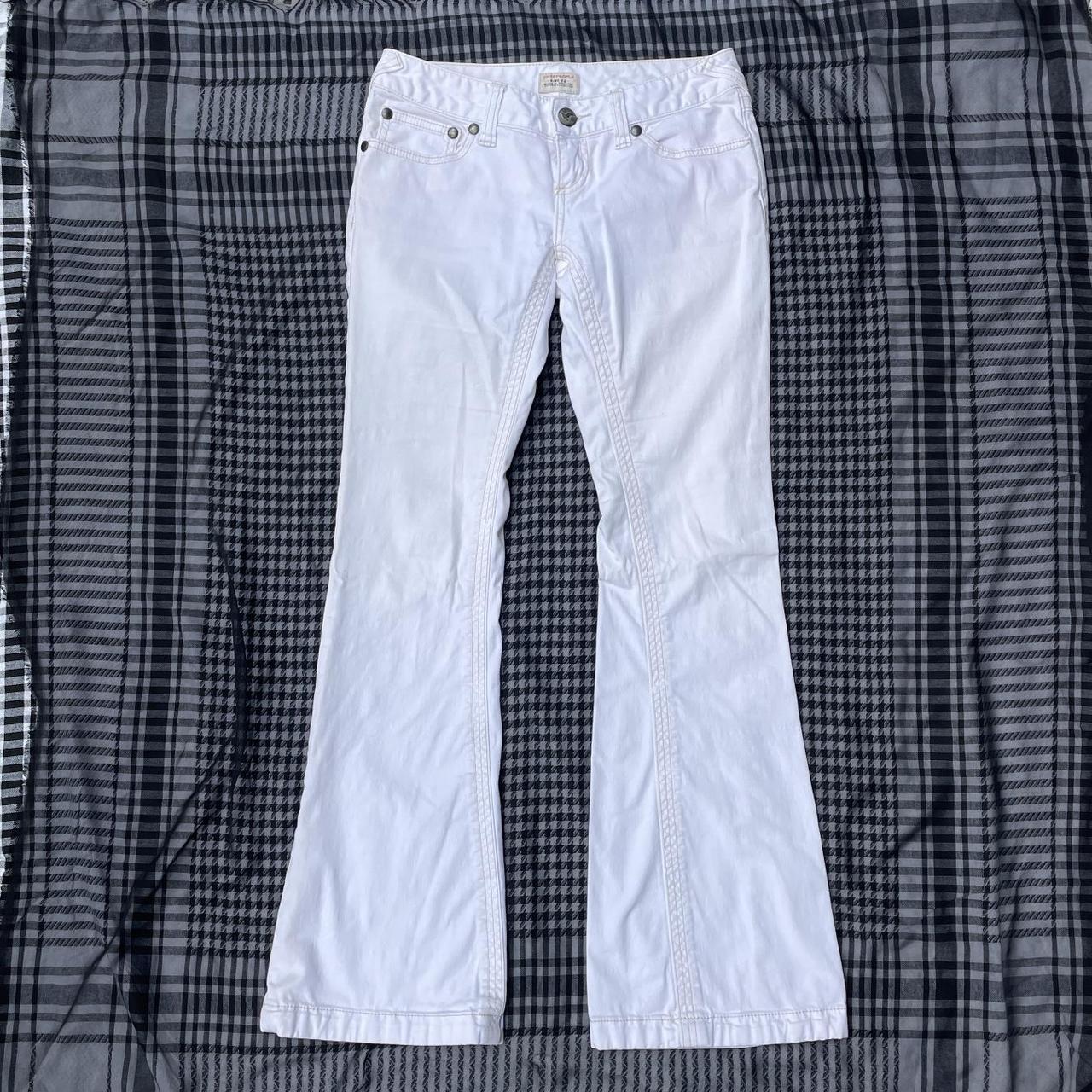 Ultra low rise white flared jeans by Free People -... - Depop