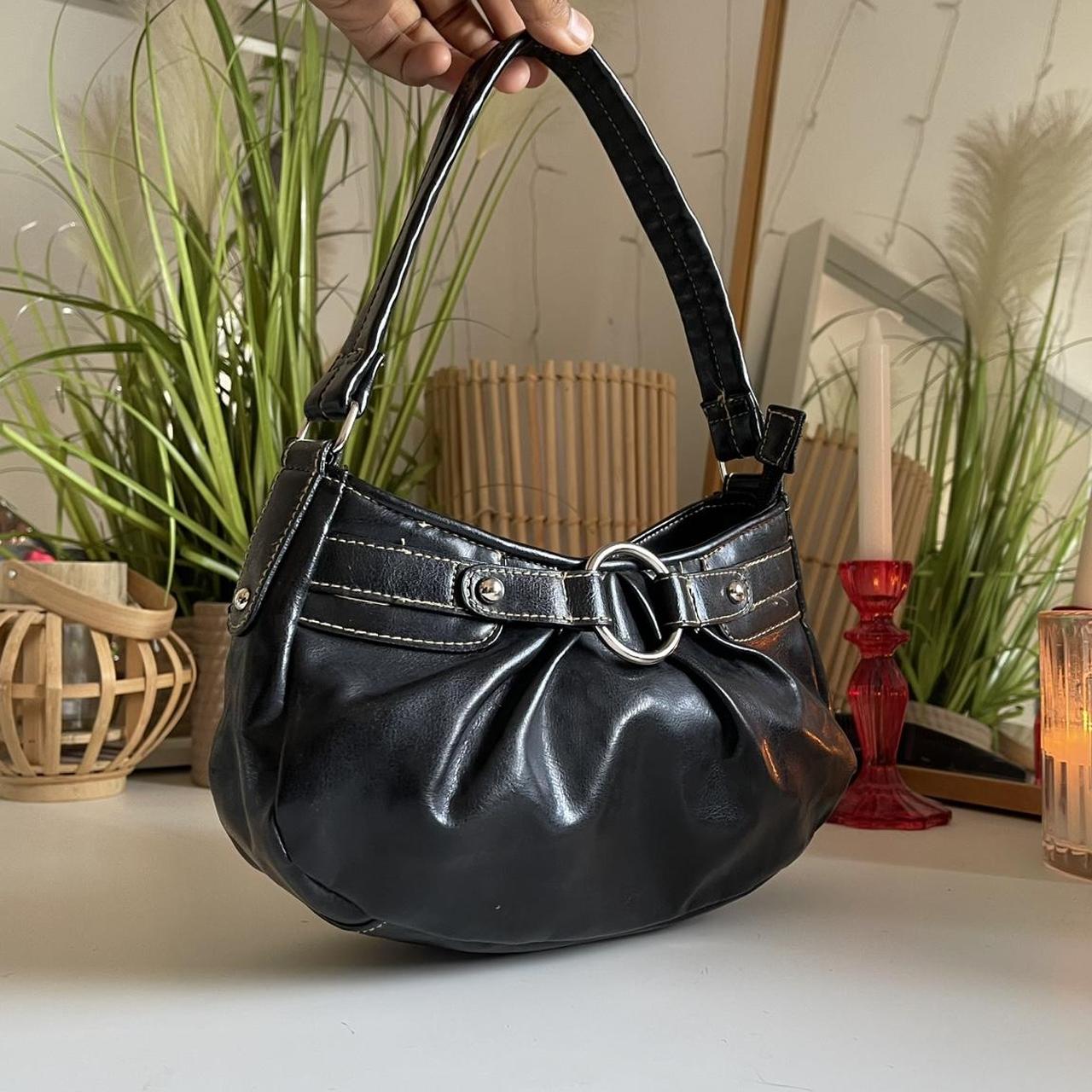 Black faux leather shoulder bag with silver buckle... | Depop