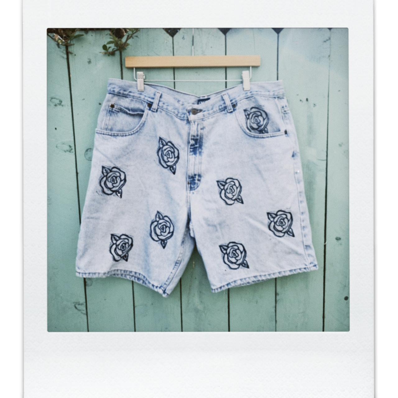 Light wash denim shorts with hand stamped design by... - Depop