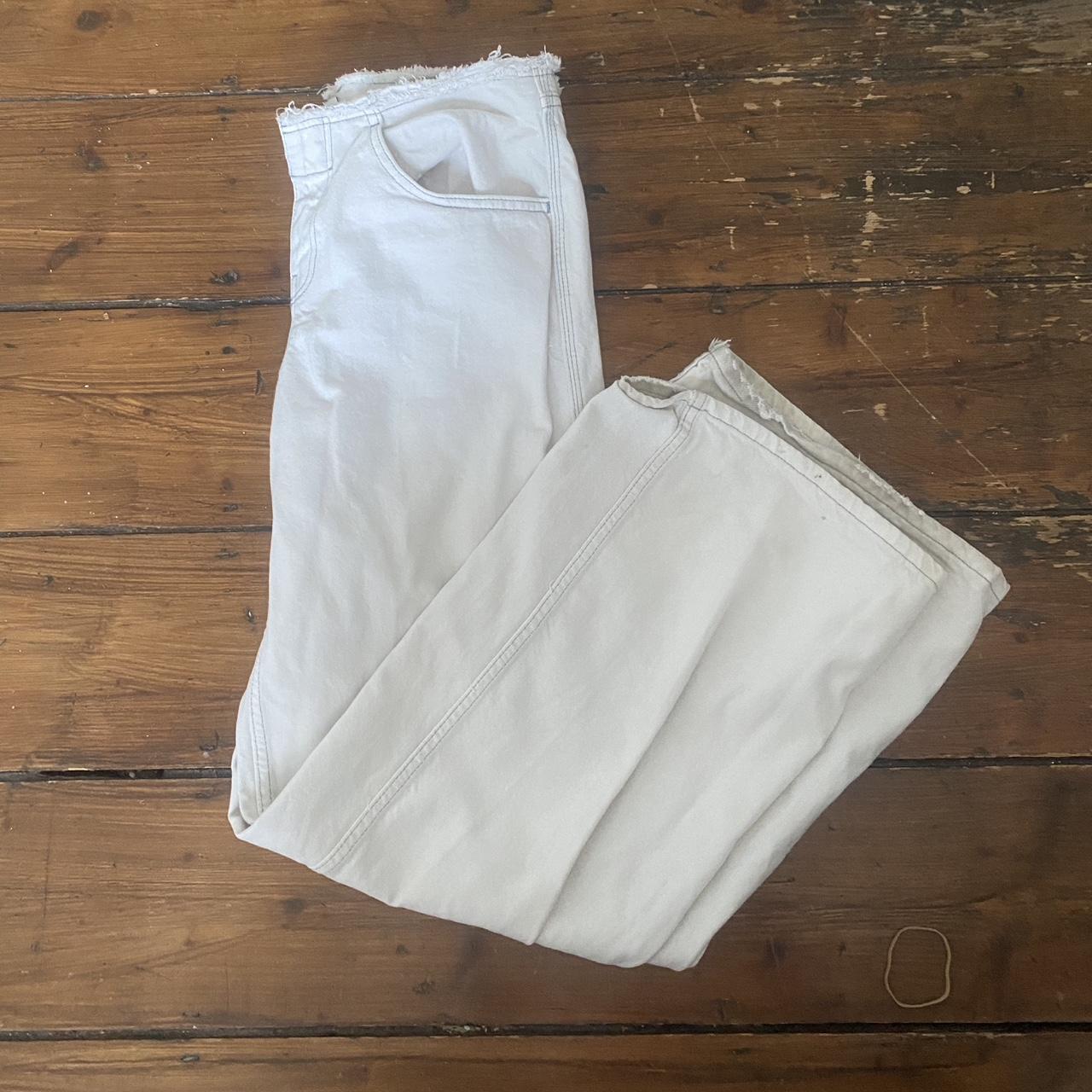 White Urban Outfitters Puddle jeans frayed hem... | Depop