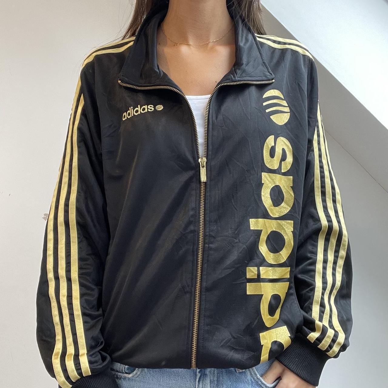 Adidas black and gold track jacket with tri stripe... - Depop