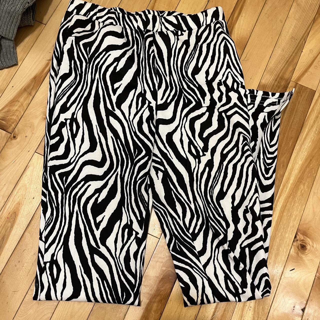 Zebra patterned flare pants! Very comfortable and... - Depop