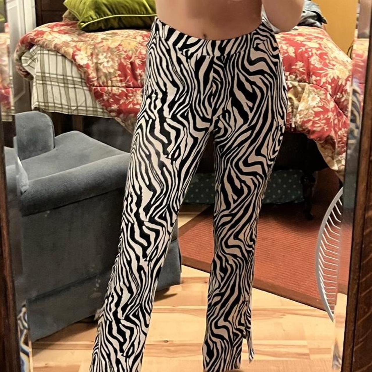 Zebra patterned flare pants! Very comfortable and... - Depop