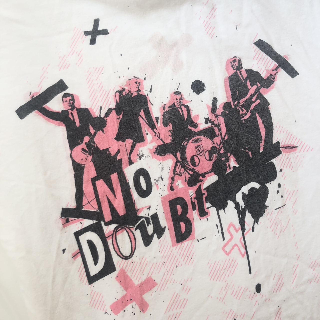 No doubt baby tee!! Probably bootleg merch from the... - Depop