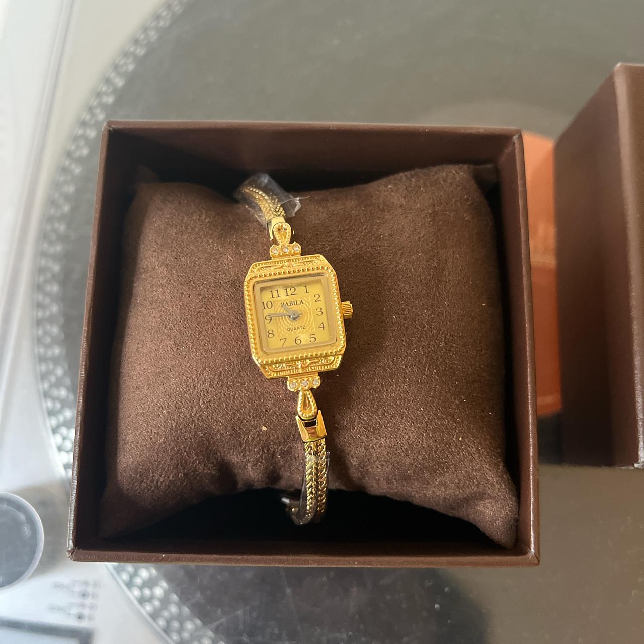 Gold tone delicate Babila watch with gold chain... | Depop
