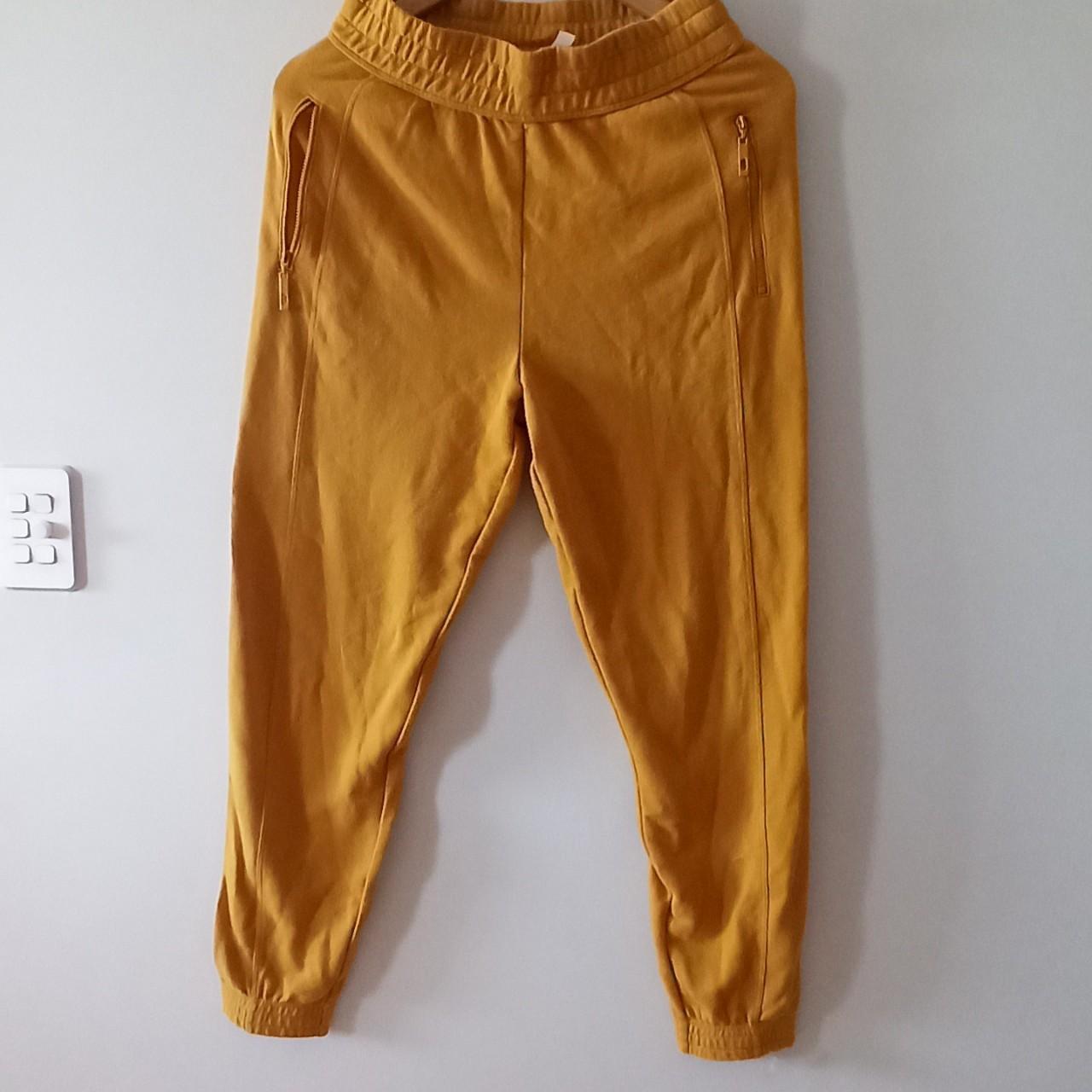 Fabletics yellow track pants. High waisted, some... - Depop