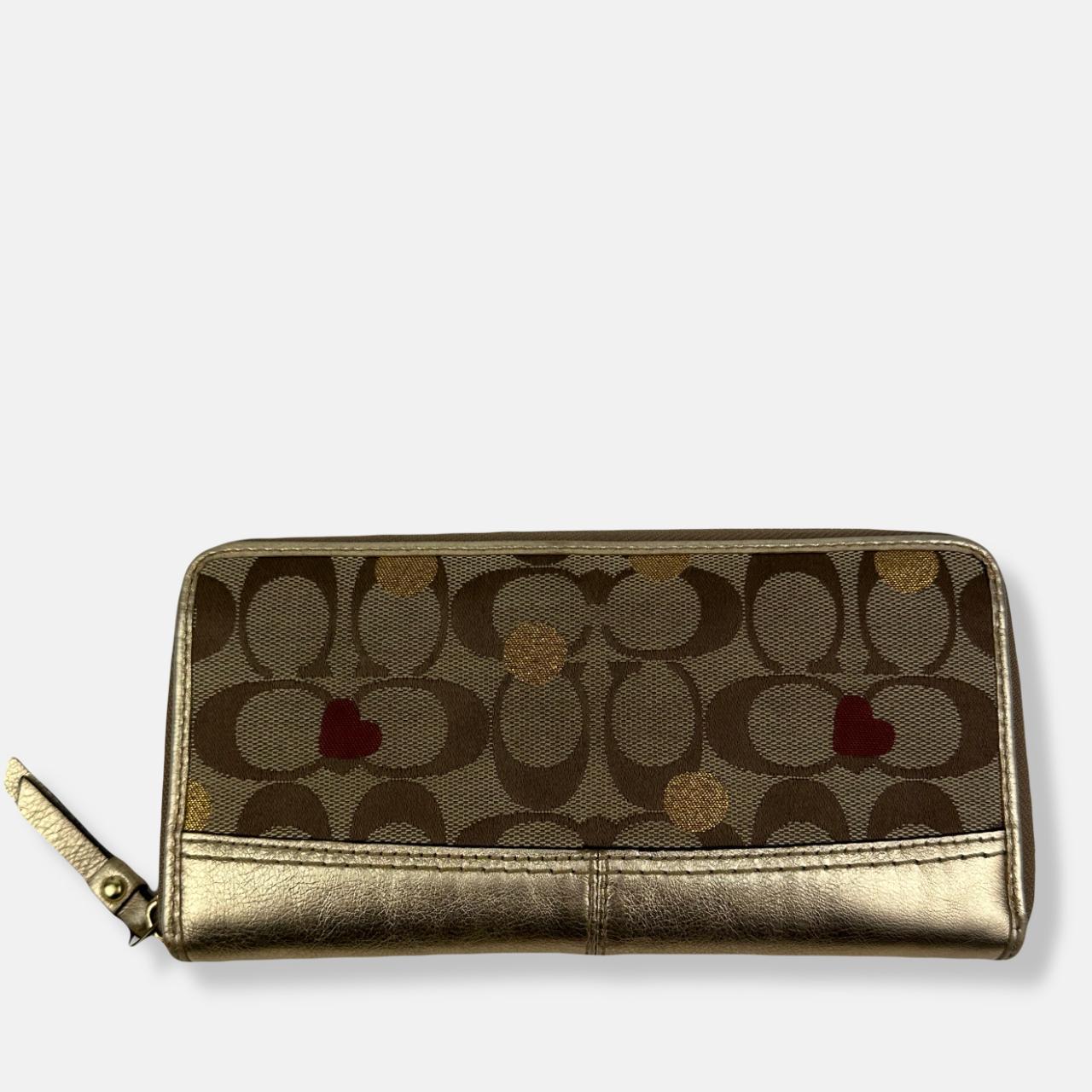 This iconic Coach Gold Leather Accordian Zip Wallet... - Depop