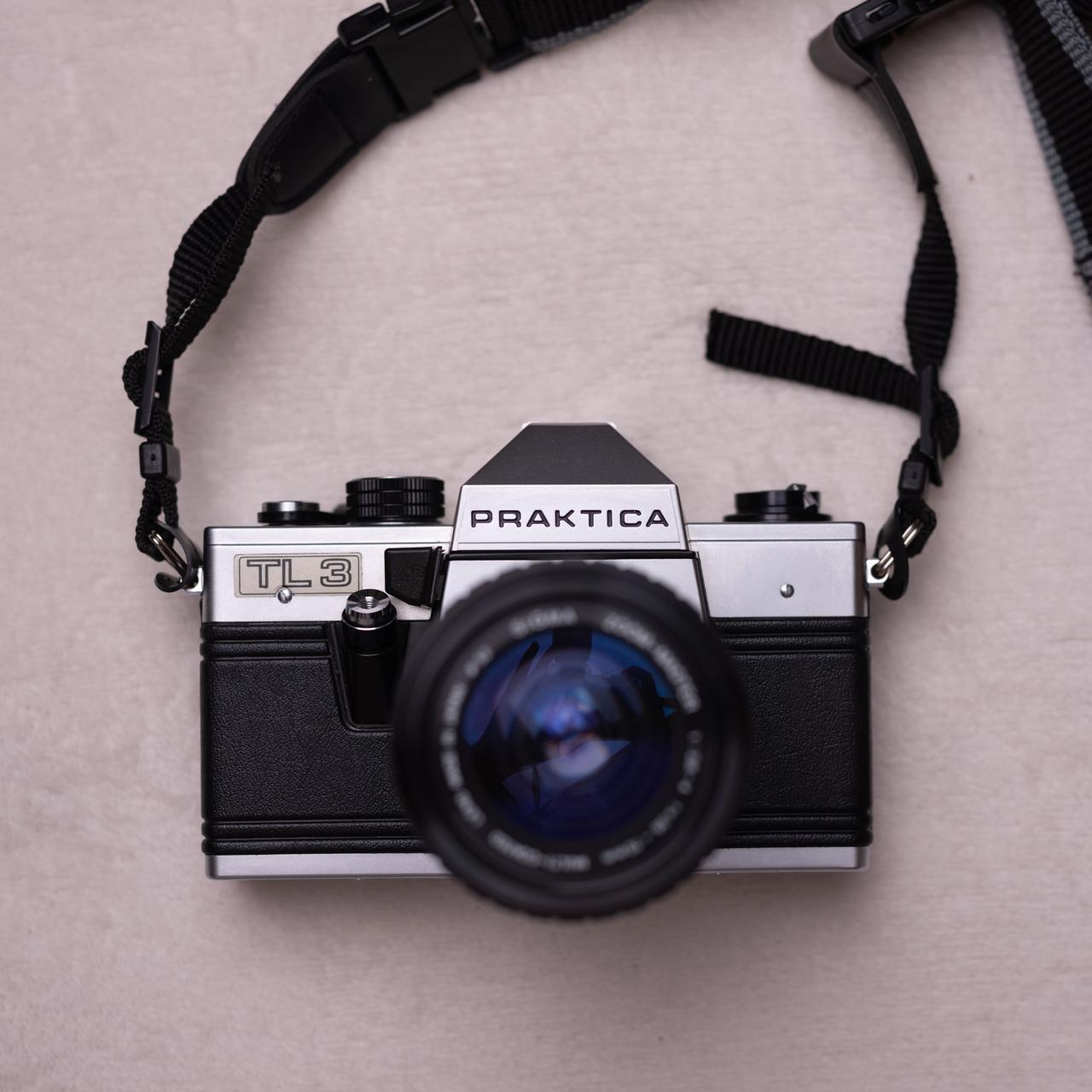 Praktica TL3. TL3 is a manual SLR camera with a... - Depop