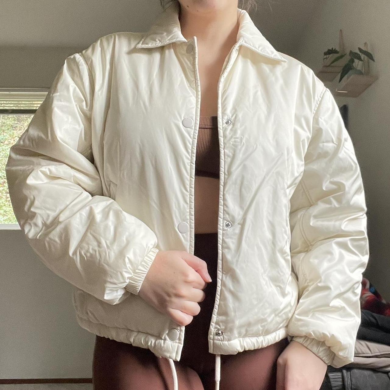 aritzia TNA white cream coaches puffer jacket.... - Depop