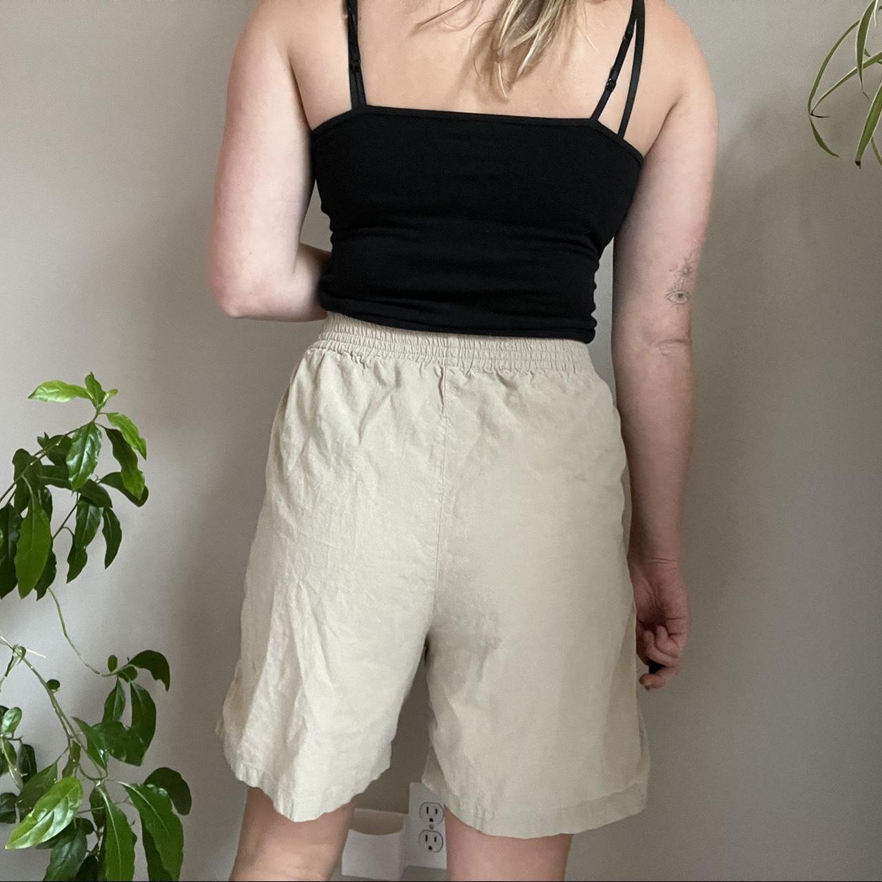 Light tan long baggy workout shorts. Have elastic... - Depop