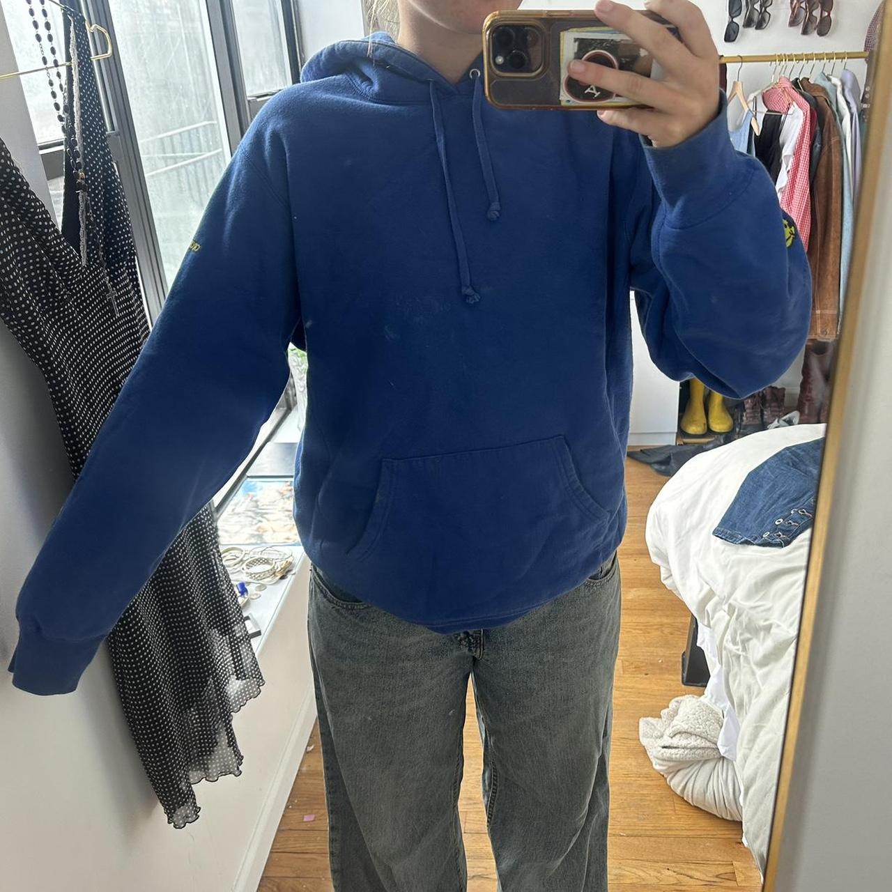 Navy and blue supreme hoodie with a small yellow... | Depop