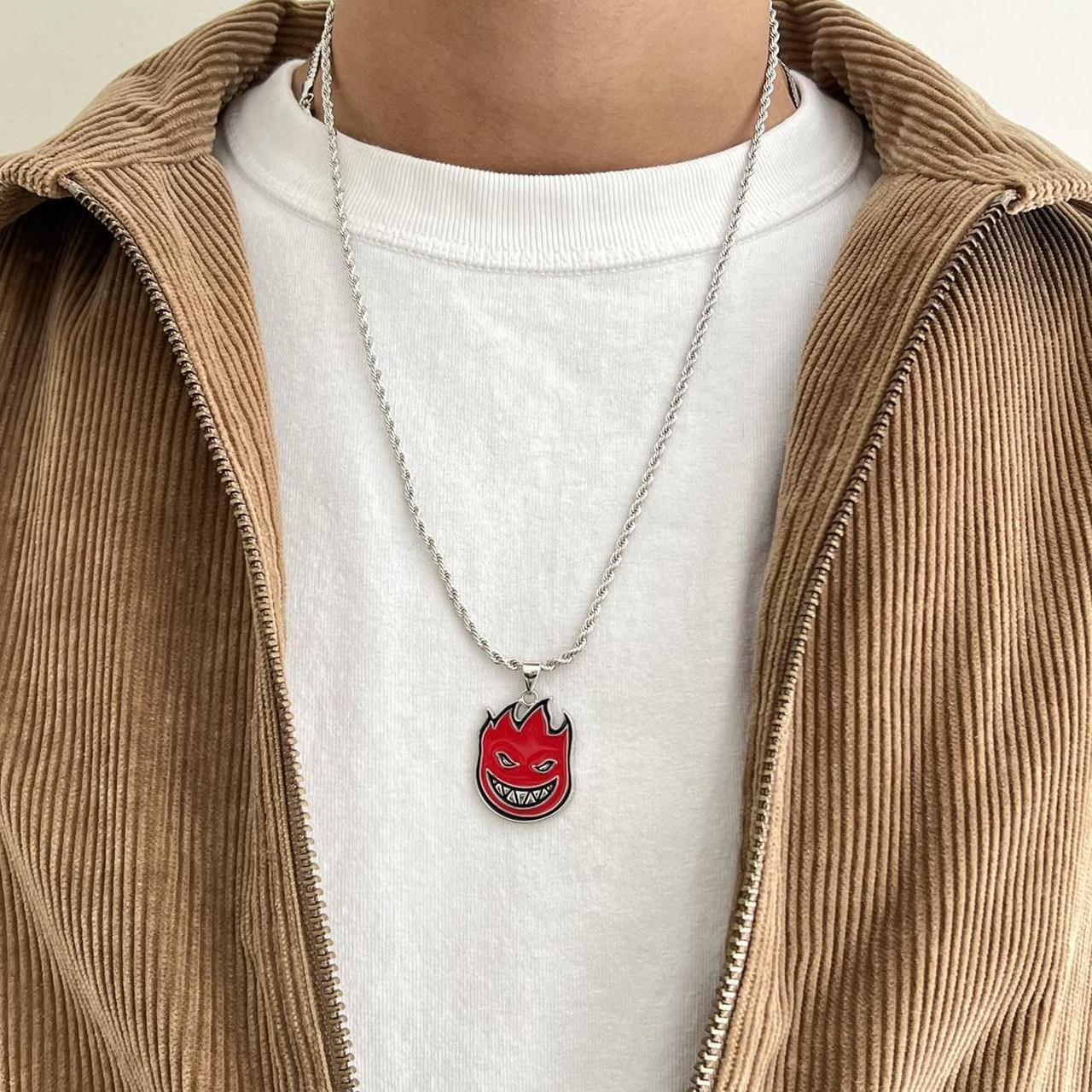 y2k style silver chrome spitfire skater pendant... | Depop