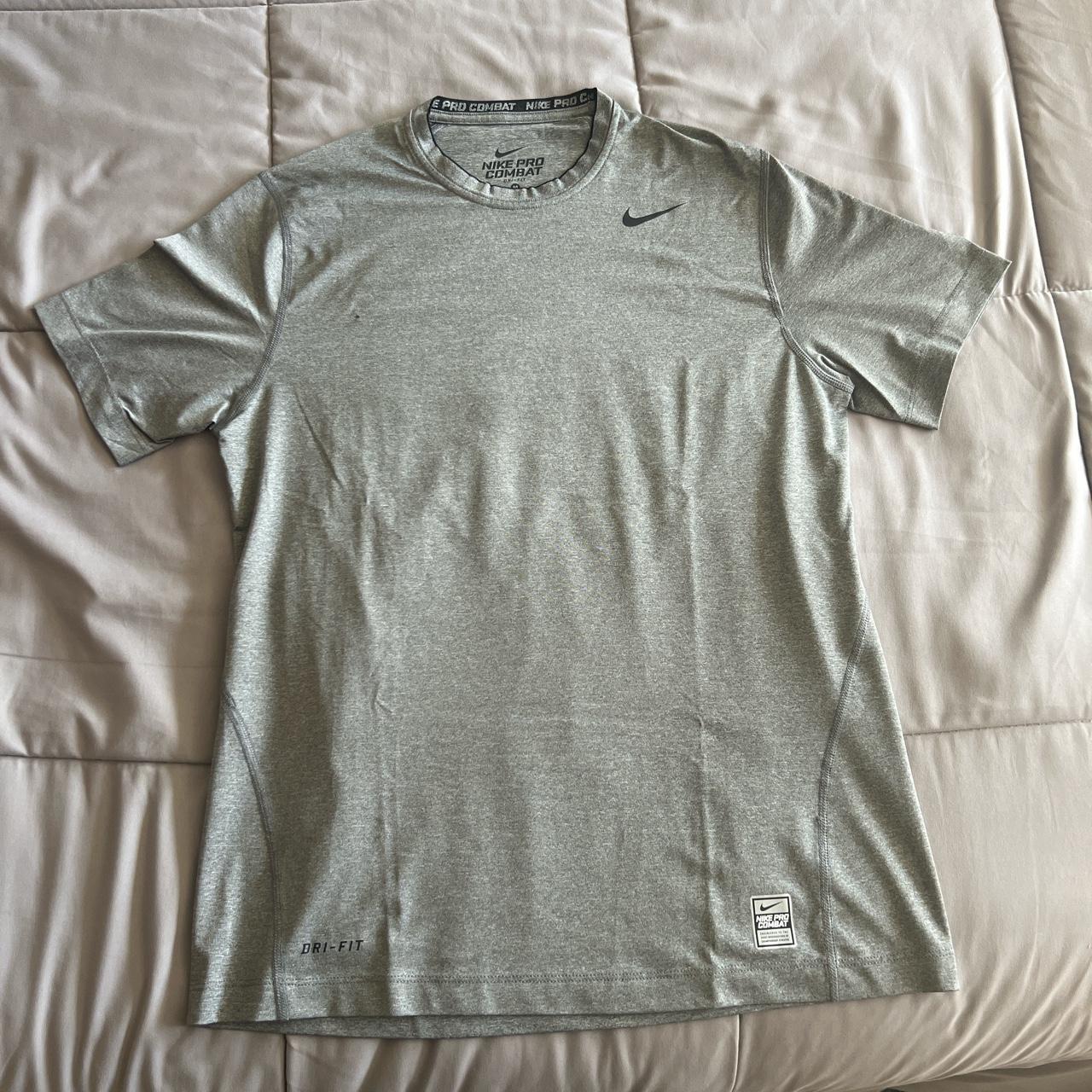Grey nike pro combat shirt in great condition. And... - Depop