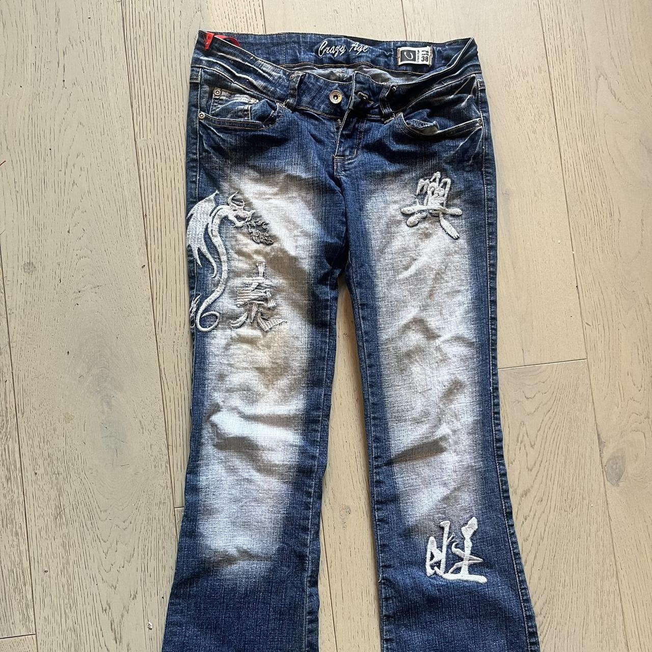 Flared graphic embroidered y2k low waisted jeans... - Depop