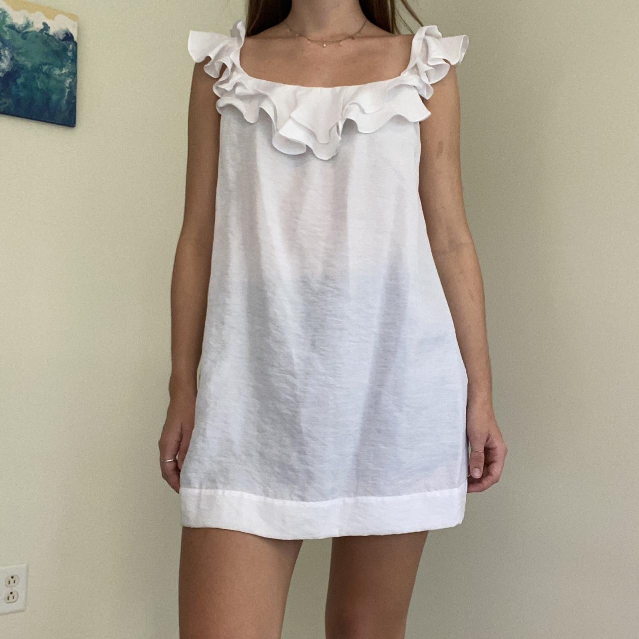 White dress with ruffle detailing on the neckline... - Depop