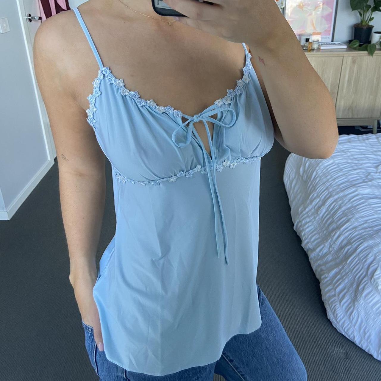 The most gorgeous baby blue cami with flower and tie... - Depop