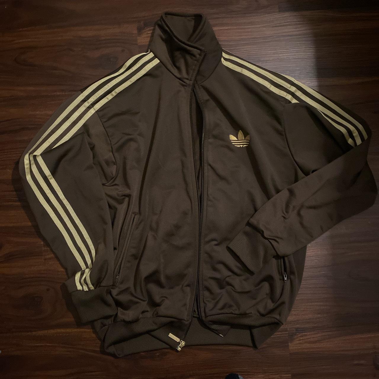 Brown adidas zip up gold stripes Silky material but... - Depop